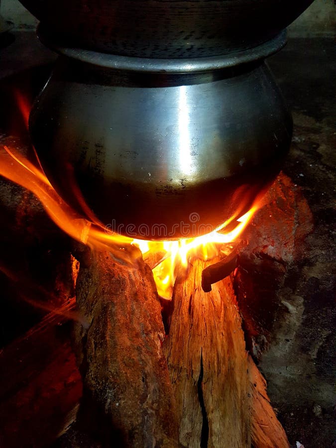 Traditional Cooking with Firewoods Stock Image - Image of yellow, light ...