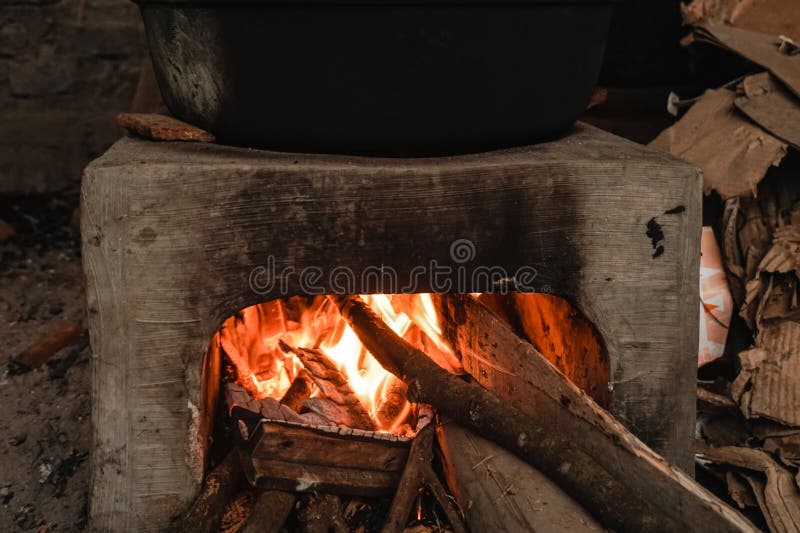 Traditional Cooking Method Using Firewood and Clay Stove Stock Image ...