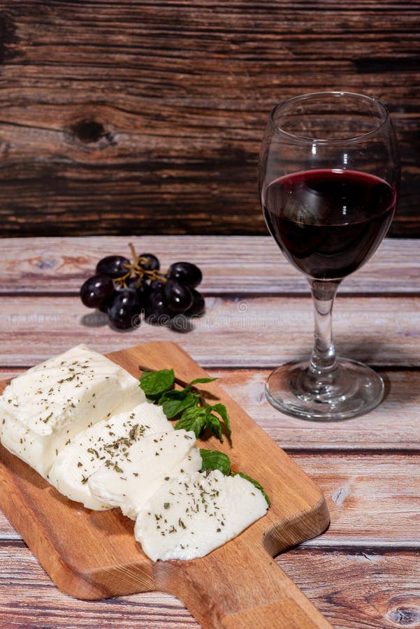 Traditional Cyprus Halloumi Cheese, Red Wine and Grapes on a Table ...