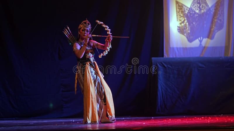 Traditional Dancer Performing with Bow and Arrow on Stage Stock Footage ...