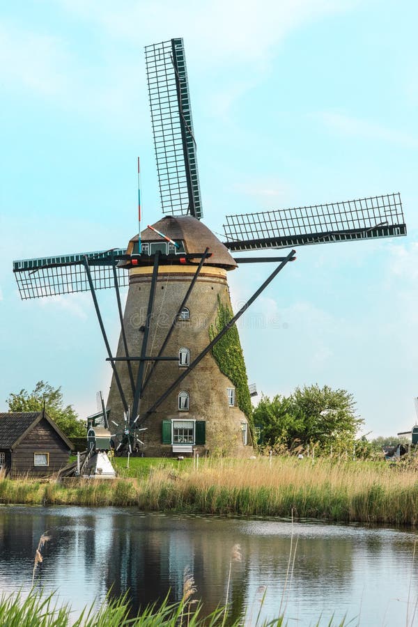 Traditional Dutch Windmills with Green Grass in the Foreground, the ...