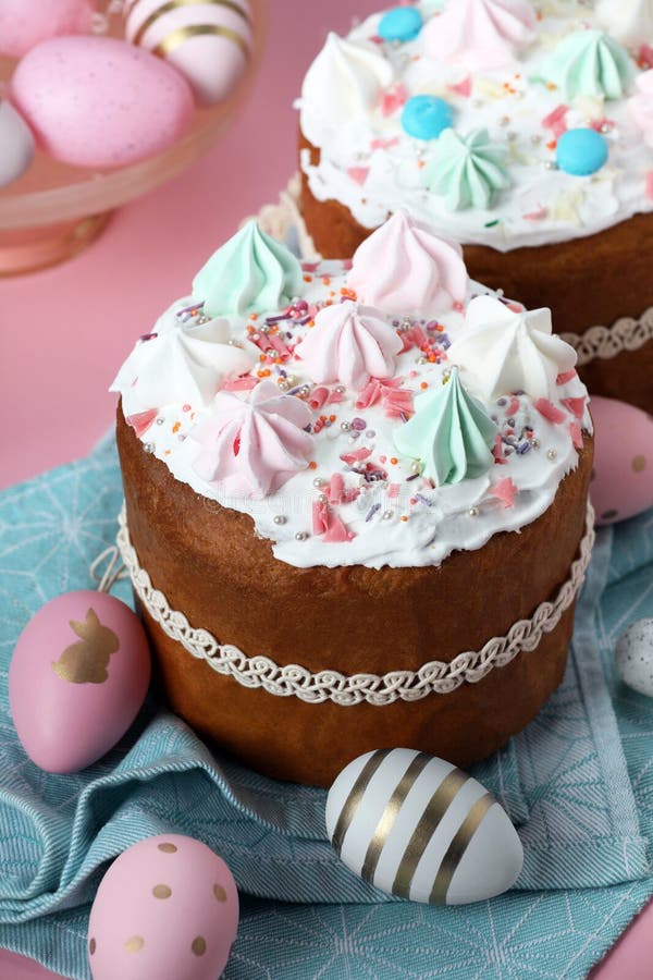 Traditional Easter Cakes with Meringues and Painted Eggs on Pink ...