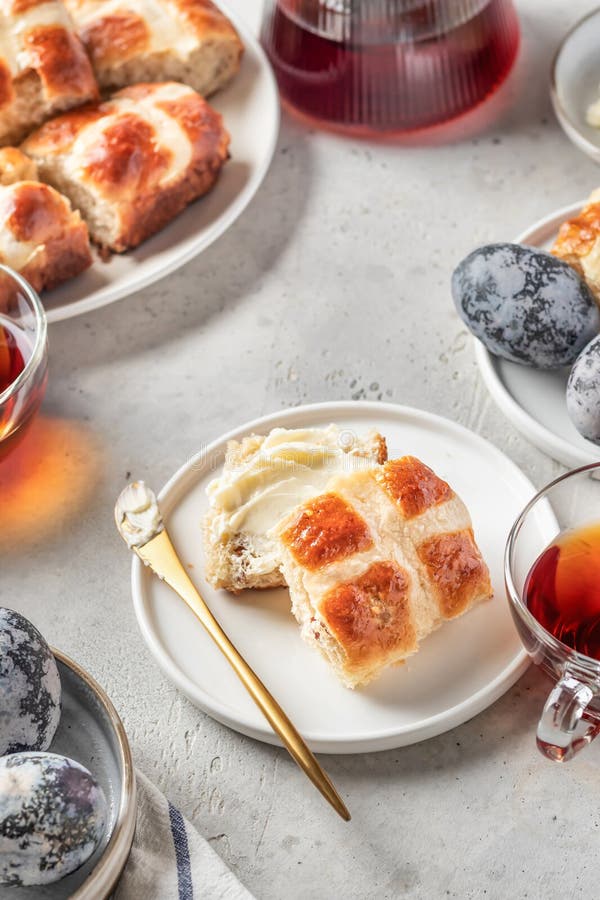 Traditional Easter Hot Cross Buns on White Plate with Butter, Cup of ...