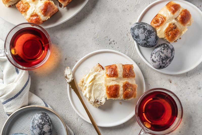 Traditional Easter Hot Cross Buns on White Plate with Butter, Cup of ...