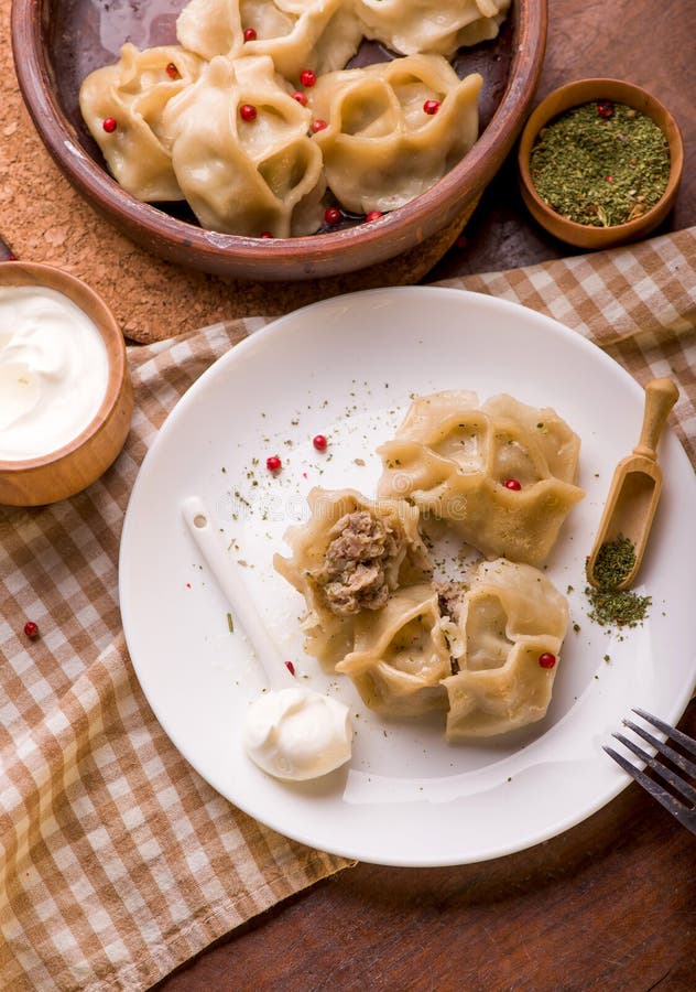 Traditional Eastern Dish Manti or Manty with Beef in a Dark Stock Photo ...