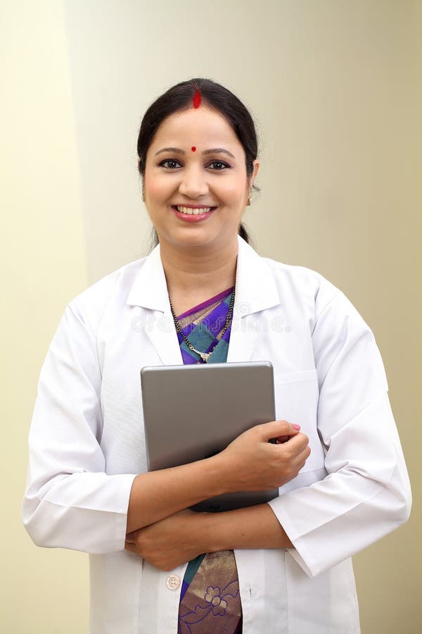 Traditional Female Doctor Holding Tablet Computer Stock Image - Image ...