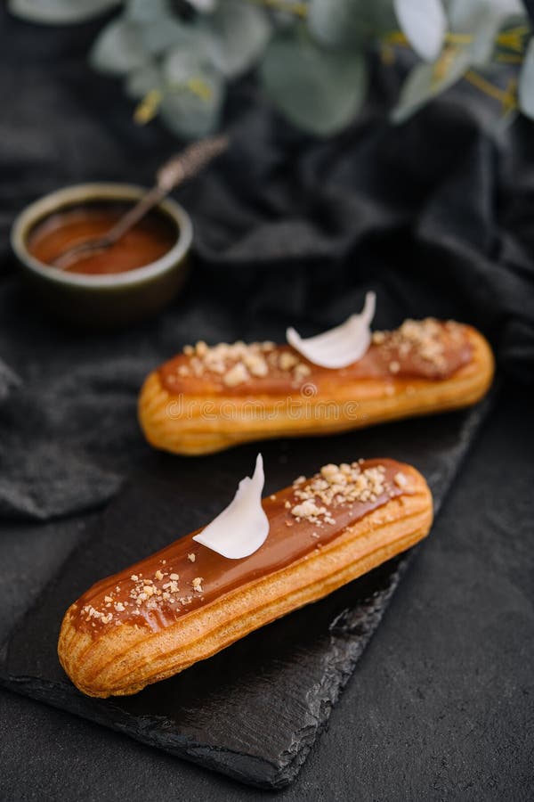 Traditional French Dessert. Eclair with Caramel Stock Photo - Image of ...