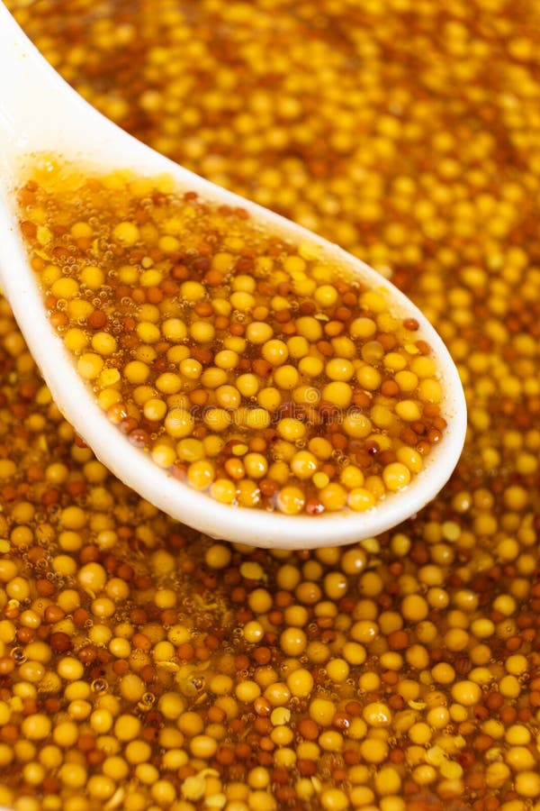 Traditional French Dijon Mustard in a Spoon on a White Background Stock ...