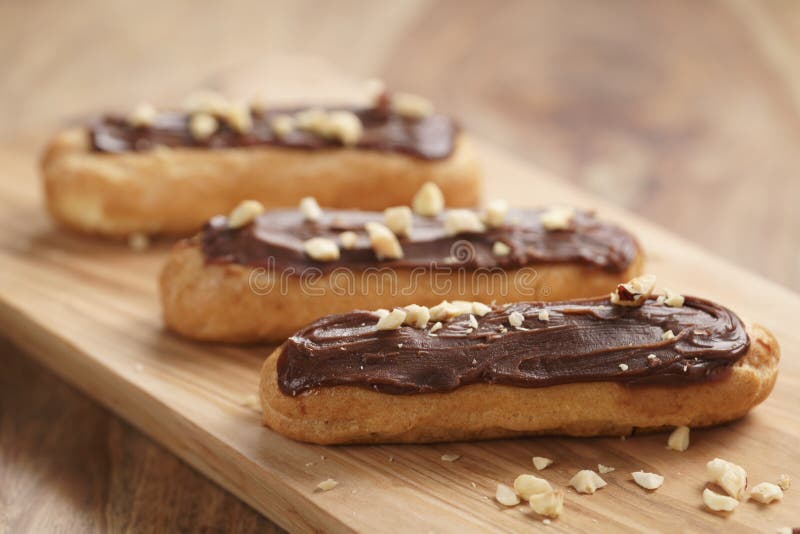 Traditional French Eclairs with Chocolate and Hazelnuts Stock Image ...
