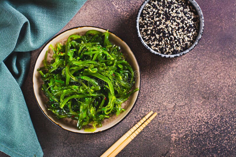 Traditional Fresh Seaweed and Sesame Salad on a Plate on the Table Top ...