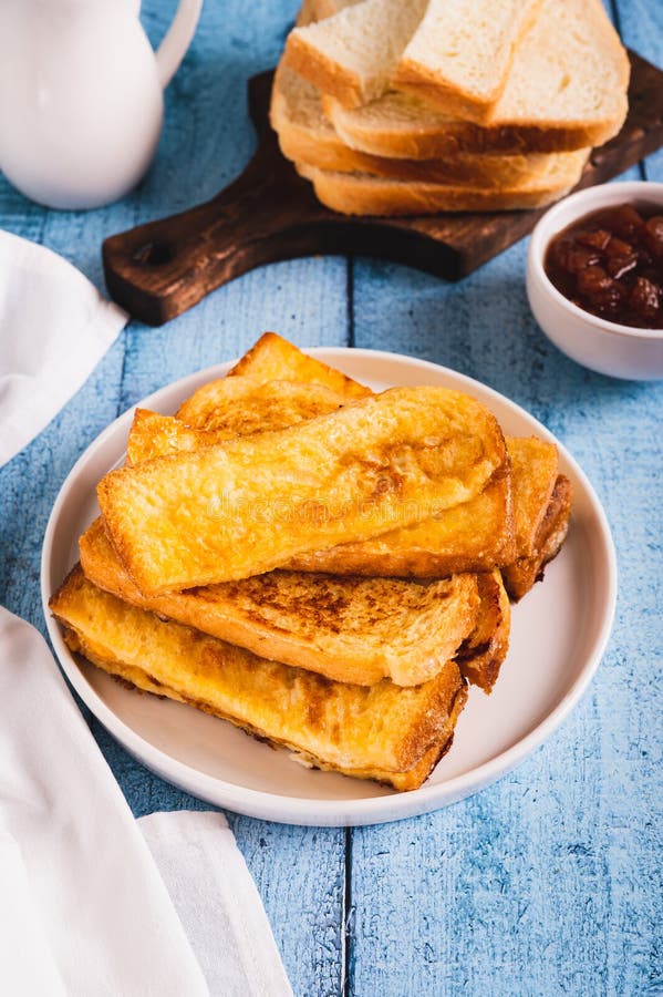 Traditional Fried French Toasts on White Plate on Table Vertical View ...