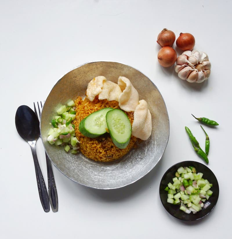 Traditional Fried Rice Serve on Silver Plate with Crackers, Cucumber ...