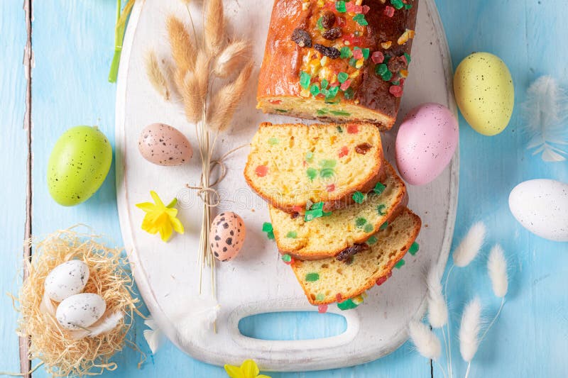 Traditional Fruitcake for Easter Surrounded by Spring Flowers Aand Eggs ...