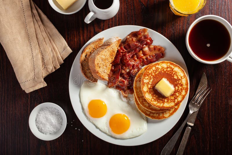 Traditional Full American Breakfast Eggs Pancakes with Bacon and Toast ... Traditional Full American Breakfast Eggs Pancakes with Bacon and Toast ...