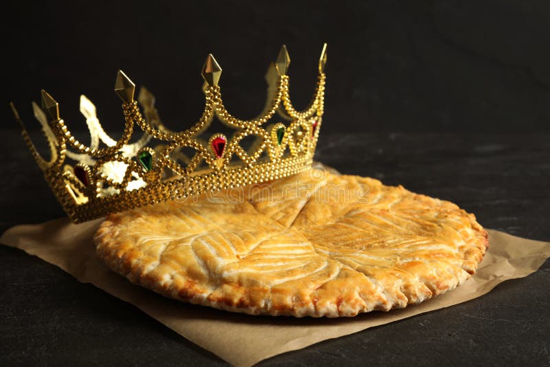Traditional Galette Des Rois with Decorative Crown on Black Table Stock ...