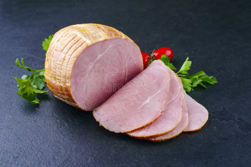 Traditional German Boiled Easter Ham with Tomatoes and Parsley on a ...