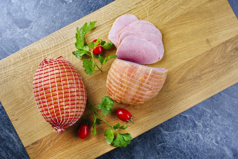 Traditional German Boiled Easter Ham with Tomatoes and Parsley on a ...