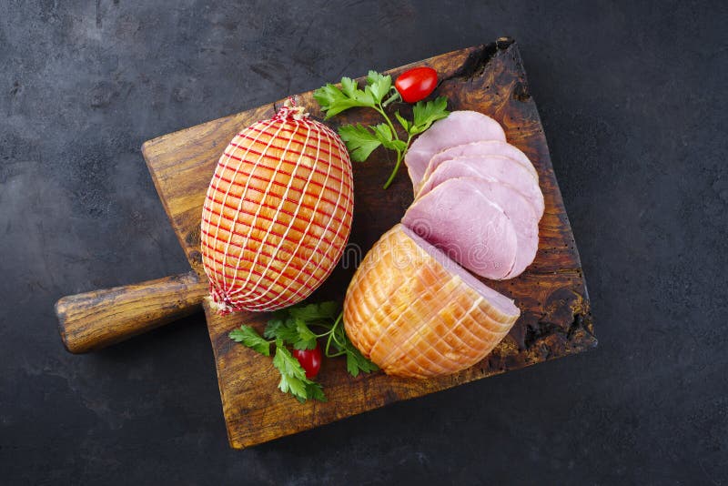 Traditional German Boiled Easter Ham with Tomatoes and Parsley on an ...