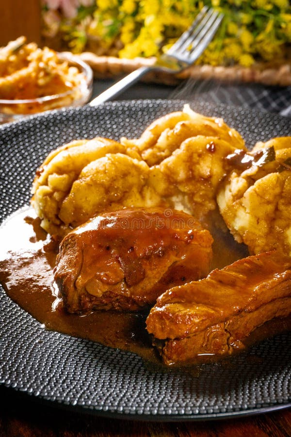 Traditional German Braised Pork Cheeks in Brown Sauce Stock Image ...