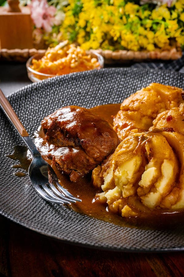 Traditional German Braised Pork Cheeks in Brown Sauce Stock Photo ...