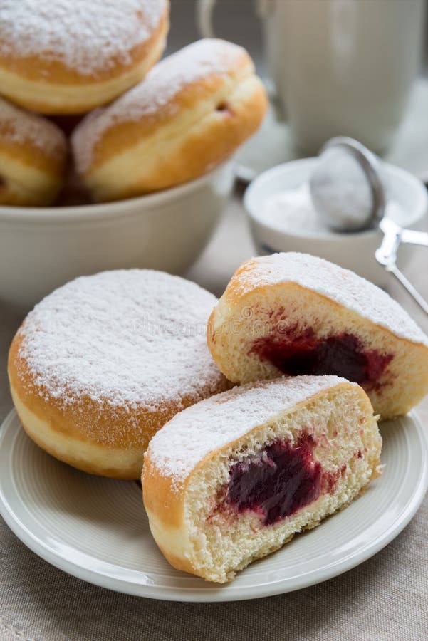 Traditional German Polish Donut with Raspberry Jam Dusted with Icing ...