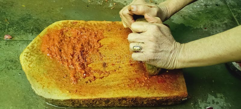 Traditional Grinding Whole Spices on Grindstone Stock Image - Image of ...