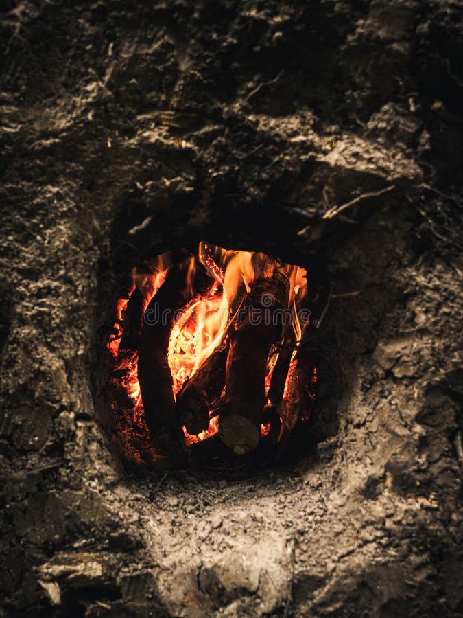 Traditional Ground Oven with a Campfire Inside Stock Photo - Image of ...