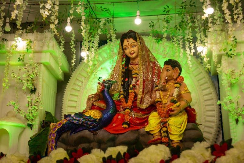 Traditional Idol of Goddess Parvati with Lord Ganesha. Stock Photo ...