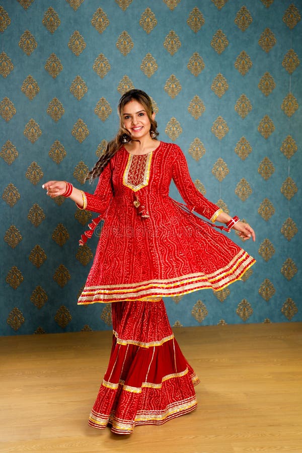 Traditional Indian Lady in Red Sharara Suit Posing in Front of Camera ...