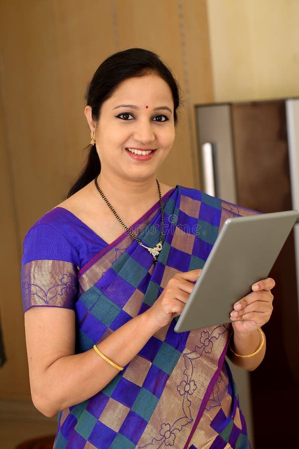 Traditional Indian Woman Using a Tablet Computer Stock Photo - Image of ...