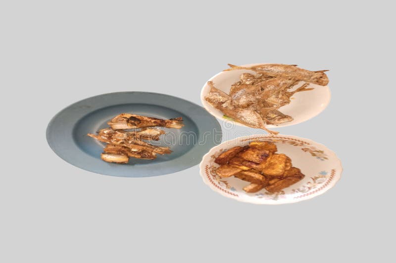 A Traditional Indonesian Dish of Fried Tempeh and Fried Fish on Three ...