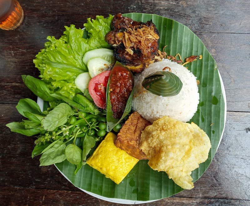 Traditional Indonesian Rice Culinary Complete with Vegetables in Banana ...