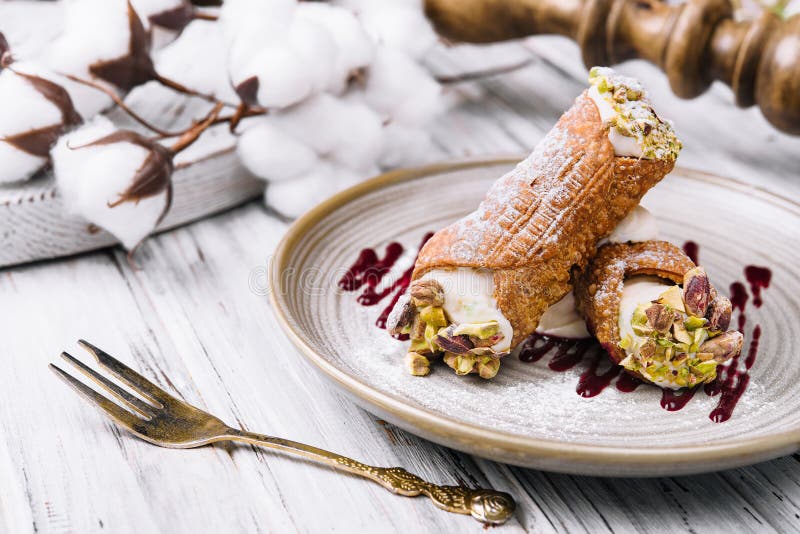 Traditional Italian Dessert Cannoli Siciliani on Plate Stock Photo ...