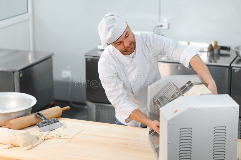 Traditional Italian Food. Side View of Handsome Chef Rolling a Dough ...