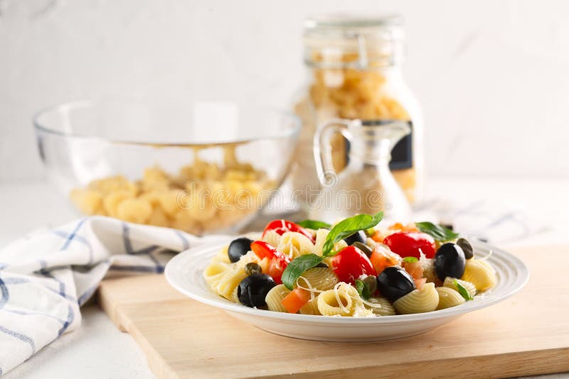 Traditional Italian Pasta Pipe Rigate with Tomatoes, Olives Stock Image ...