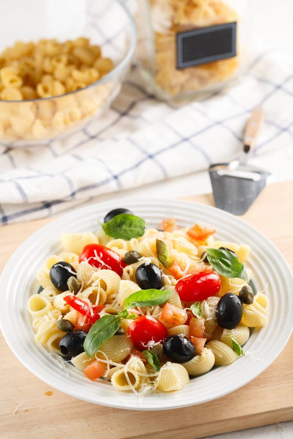 Traditional Italian Pasta Pipe Rigate with Tomatoes, Olives Stock Image ...