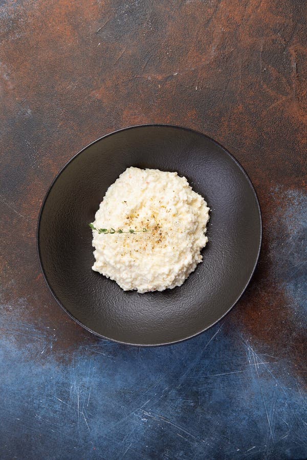 Traditional Italian Risotto in a Dark Plate Stock Photo - Image of ...