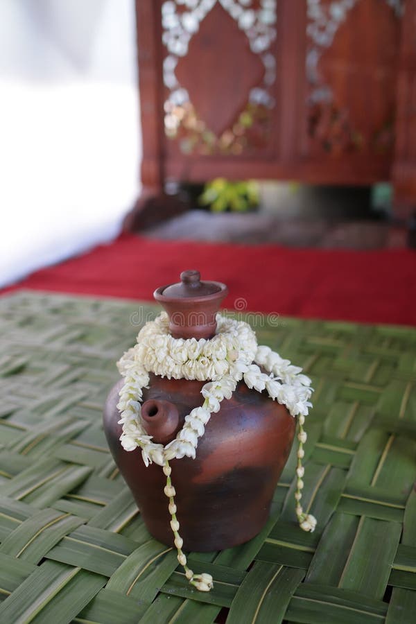 Traditional javanese jug stock image. Image of flowers - 373757809