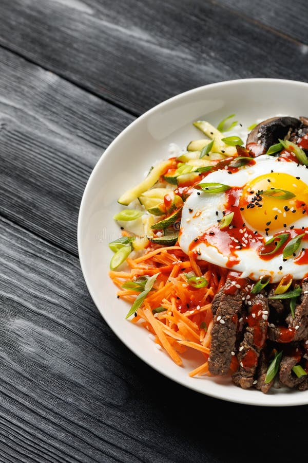 Traditional Korean Dish Bibimbap with Rice, Vegetables Beef and Egg in ...