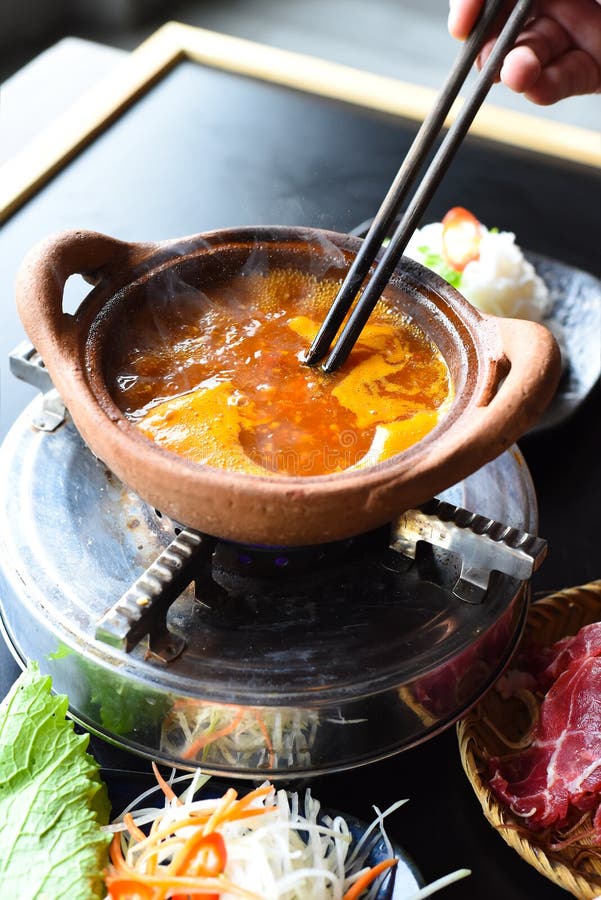 Traditional Korean Hot Pot Dish with Beef and Spicy Bouillon on Black ...