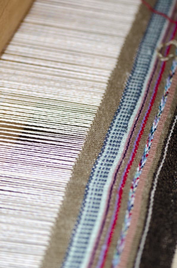 Traditional Loom Weaving an Ornate Rug with Floral Pattern Stock Photo ...