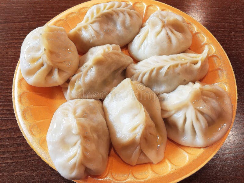 Traditional Manti with Lamb and Spices on a Plate on the Table. Stock ...