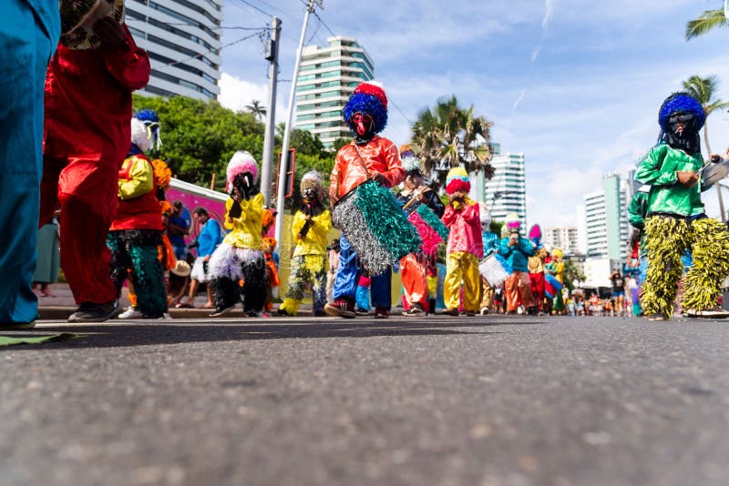 Traditional Masqueraders Make a Presentation Playing Percussion ...