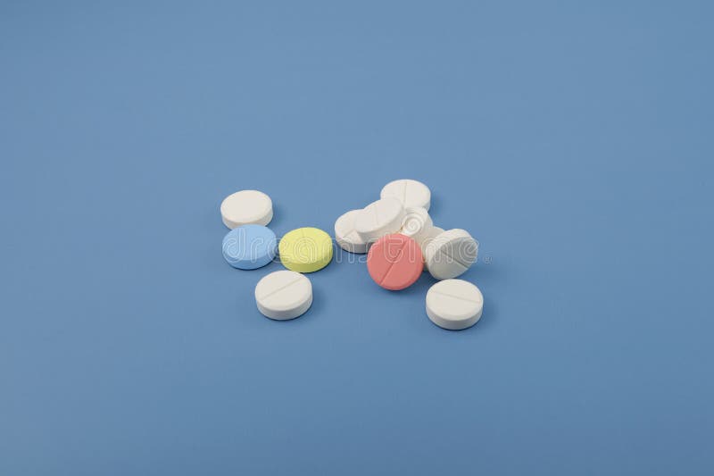 Traditional Medicine. Classic Round Tablets on Blue Background ...