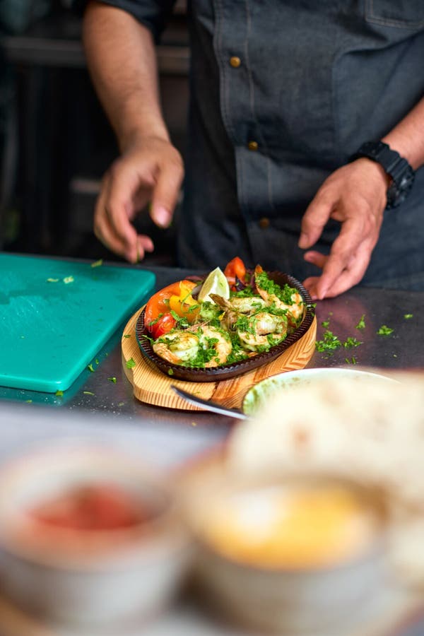 Traditional Mexican Beef Fajitas on Fire in the Kitchen, Also Called ...