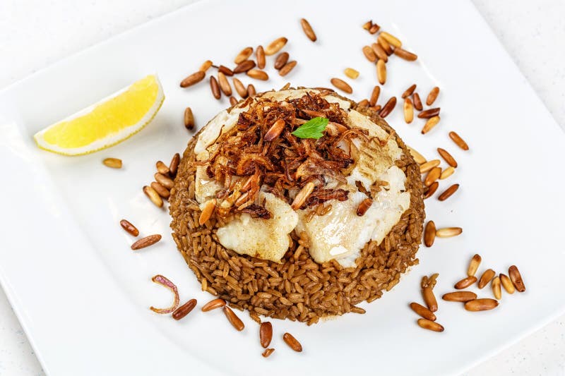 Traditional Middle Eastern Fish and Fried Rice Dish with Fried Pine ...