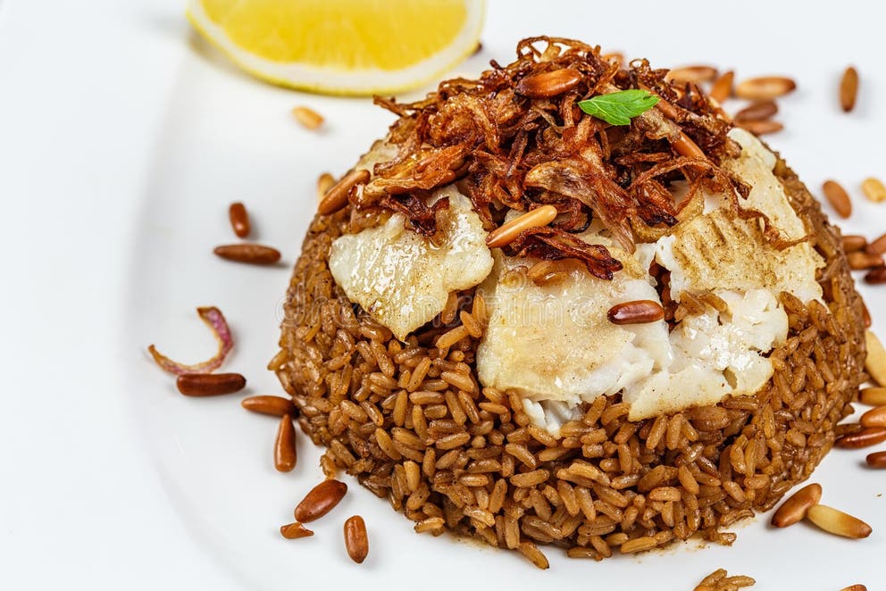 Traditional Middle Eastern Fish and Fried Rice Dish with Fried Pine ...