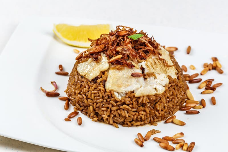 Traditional Middle Eastern Fish and Fried Rice Dish with Fried Pine ...