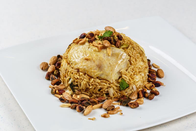 Traditional Middle Eastern Fish and Fried Rice Dish with Fried Pine ...