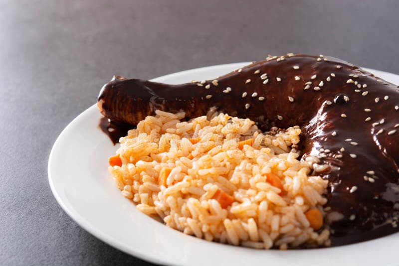 Traditional Mole Poblano with Rice in Plate Stock Photo - Image of ...